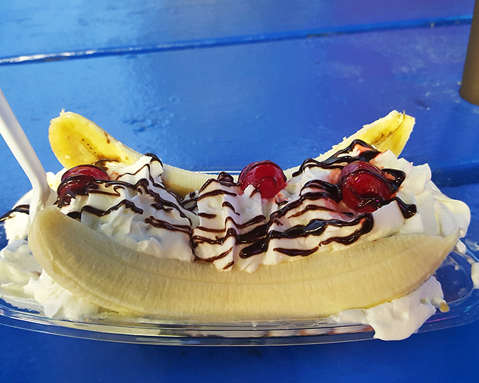 This banana split doesn't just satisfy a craving—it creates a memory, with chocolate drizzle that zigzags like a road trip through flavor country.