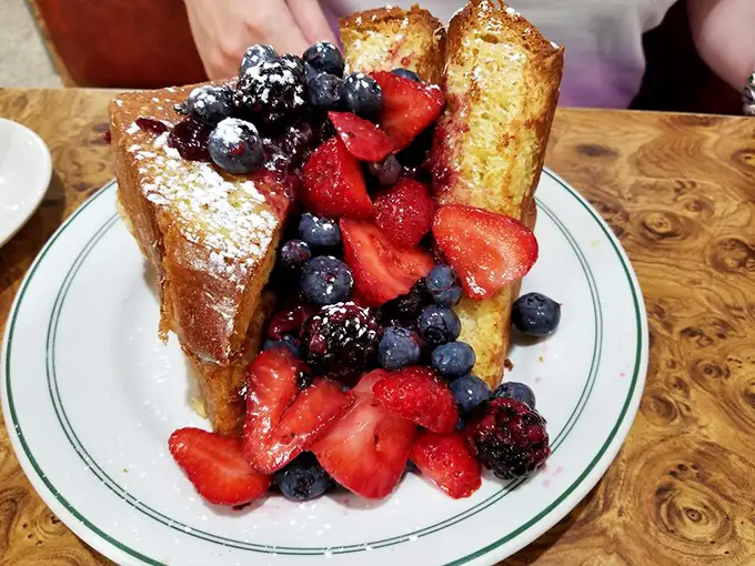 Berry French toast that belongs in the Louvre. If summer had a flavor and was served on a plate, this would be its masterpiece.
