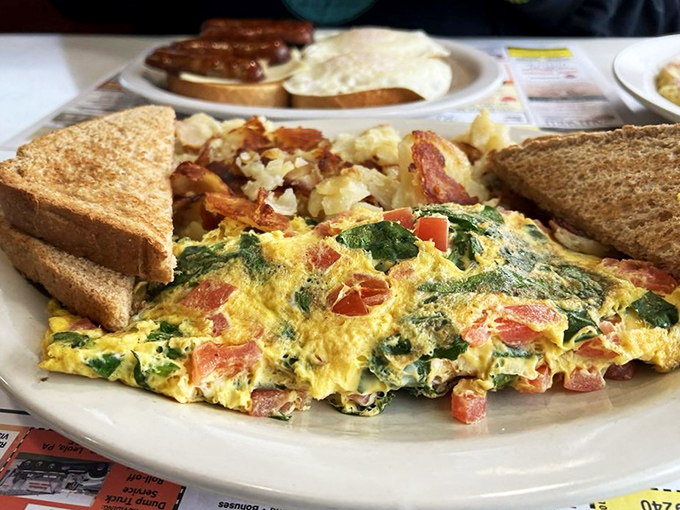 This colorful omelet and home fries combo is the breakfast equivalent of waking up to winning the lottery—and finding out calories don't count today.