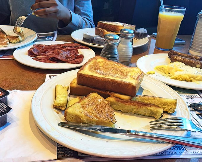 This breakfast spread could feed a Steelers offensive line – golden French toast and crispy bacon arranged in perfect morning harmony.