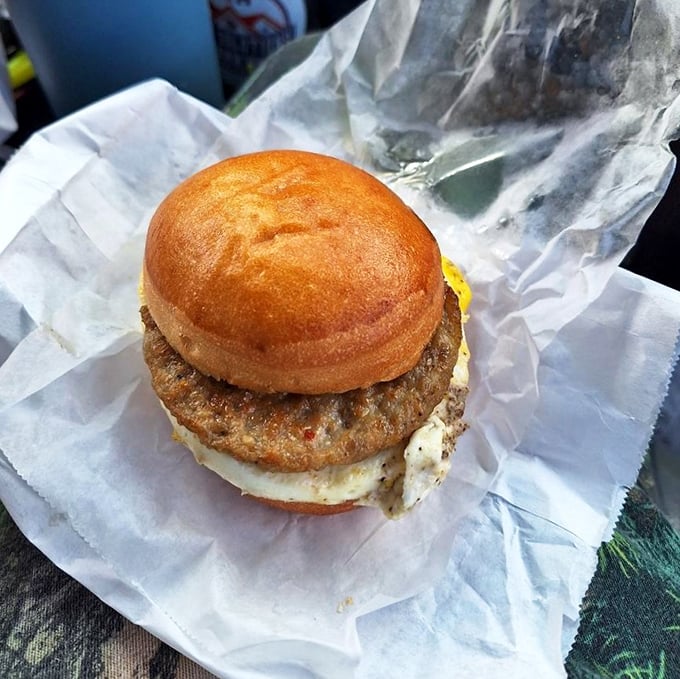 Breakfast sandwich perfection – where the humble egg and meat meet their destiny between two pieces of golden-brown bread. Morning fuel never looked so good.