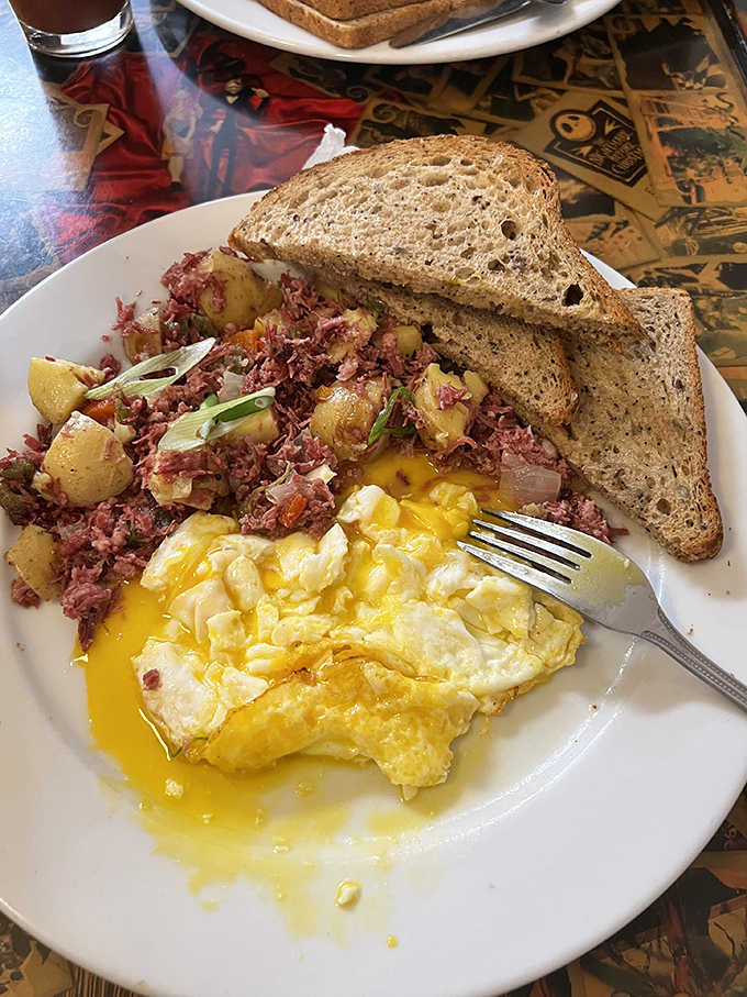 Corned beef hash that doesn't hide behind pretense—just honest-to-goodness flavor that demands to be savored. Those sunny-side-up eggs are basically liquid gold.