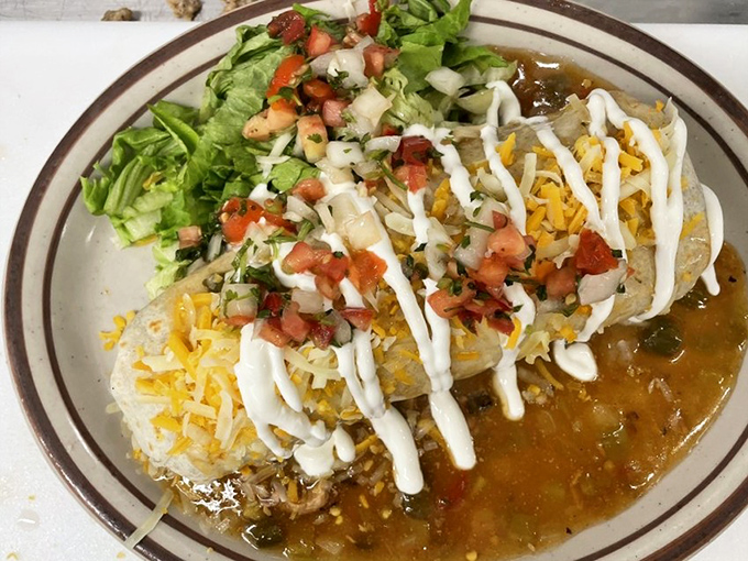 This isn't just a burrito—it's a Colorado statement piece, smothered in green chili with enough cheese to make Wisconsin nervous.