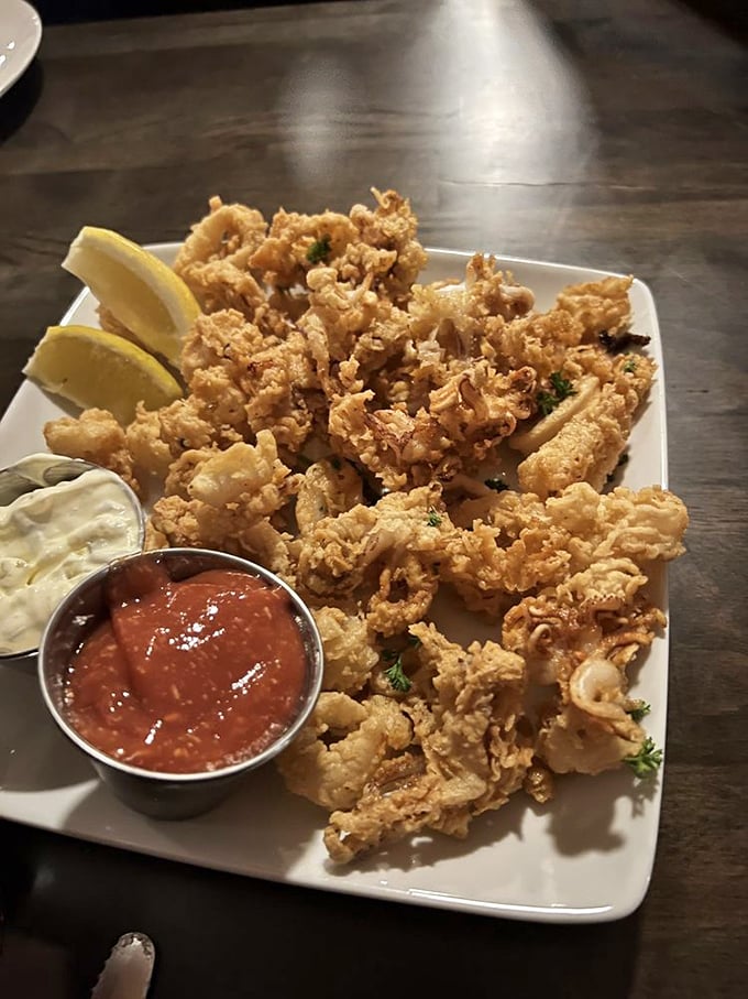 Calamari that shatters with each bite, paired with house-made sauces that make you question why you'd ever dip seafood in ketchup again.