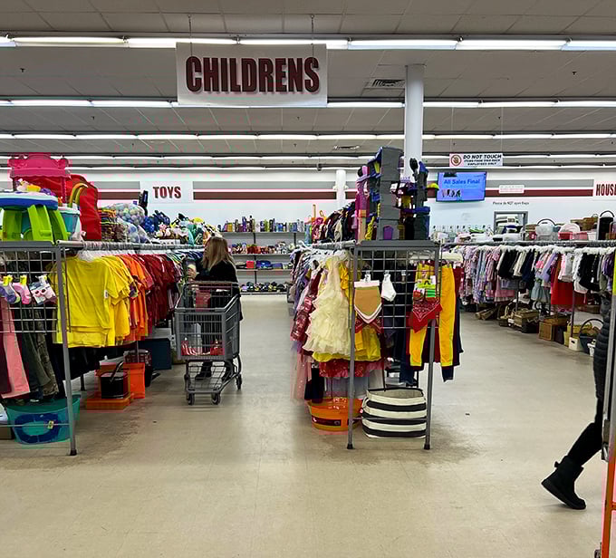 The children's section: a rainbow explosion of tiny clothes and toys where parents can outfit growing kids without growing debt.