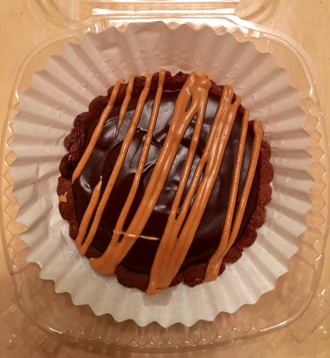 Chocolate tart with caramel drizzle – proof that British desserts have evolved far beyond spotted dick and bread pudding.
