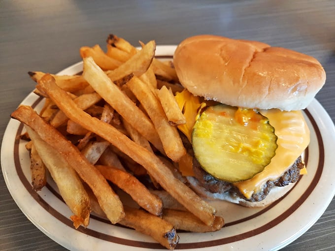 A classic cheeseburger sits proudly next to its bacon-topped cousin – simple perfection that needs no Instagram filter.