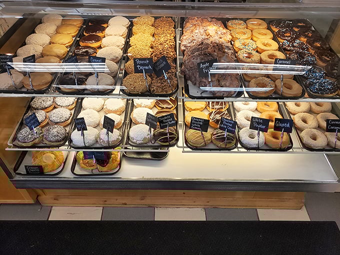 This display case isn't just showing food; it's exhibiting edible art that belongs in the Louvre of Carbohydrates.
