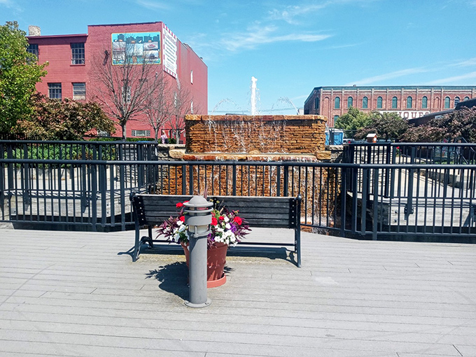 A simple bench adorned with flowers creates an urban oasis—proof that Bay City understands luxury isn't always about price tags.