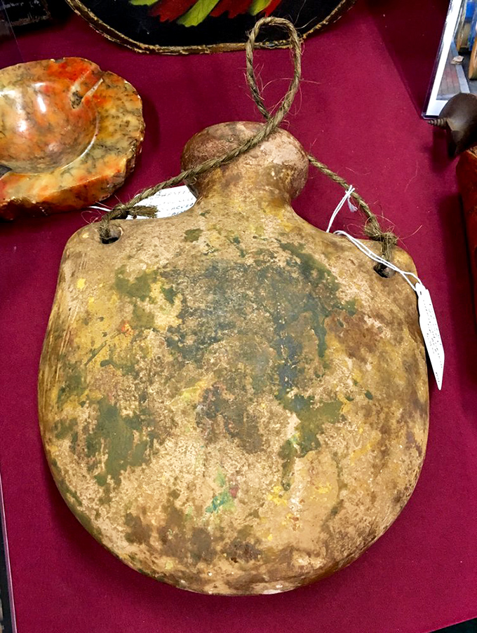 This weathered canteen could tell stories of thirst quenched on dusty trails—the original water bottle before influencers made hydration fashionable.