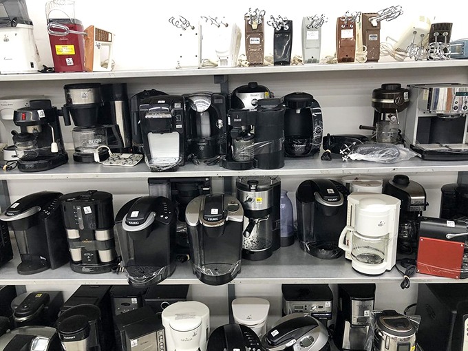 Coffee maker utopia or the final resting place of caffeine dreams? Each machine represents someone's upgrade to a fancier model or abandoned New Year's resolution.