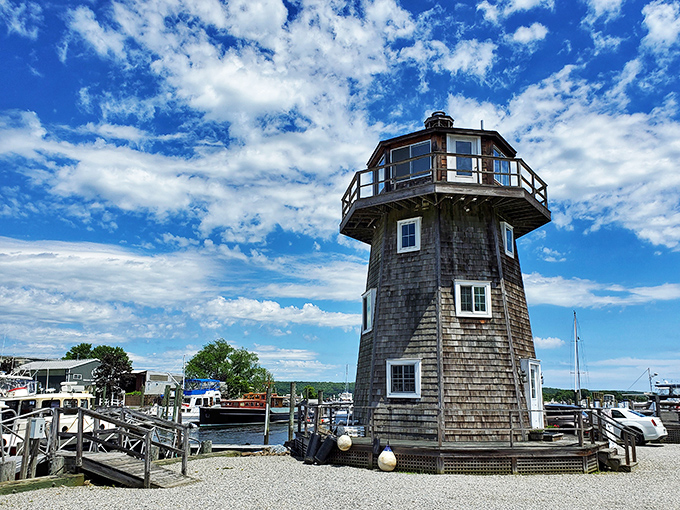 This charming lighthouse isn't just Instagram bait – it's a working harbor landmark guiding vessels through the same waters that launched America's maritime legacy.