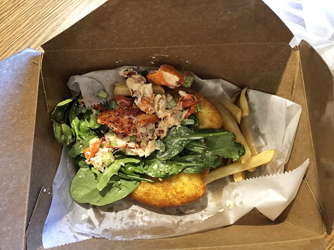 This isn't just lunch—it's edible architecture. Fresh ingredients nestled in a takeout container prove good things come in humble packages.
