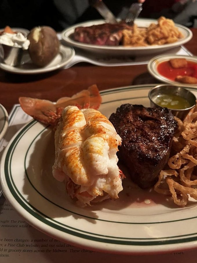 Surf meets turf in the most delicious blind date imaginable—that lobster tail looks ready for its close-up on the seafood red carpet.