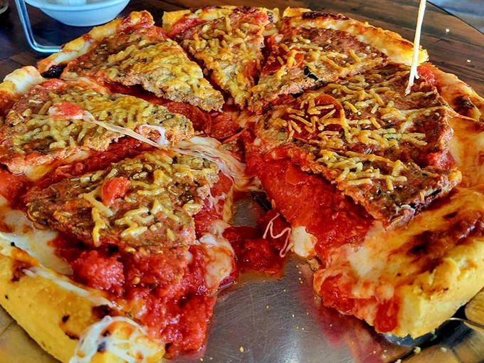 The holy trinity of pizza perfection: a buttery crust, tangy sauce, and cheese that stretches like your favorite sweatpants after Thanksgiving dinner.