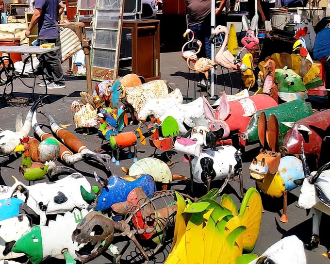 A menagerie of colorful yard art animals stands at attention—like a carnival that escaped and froze in time, waiting for new backyard homes.