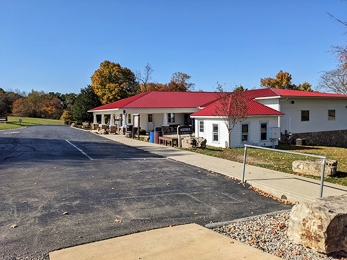 The welcoming visitor center with its distinctive red roof serves as the gateway between ordinary Ohio farmland and the extraordinary world below.