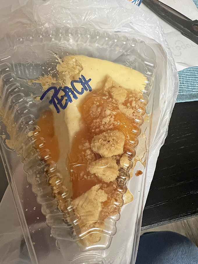 Peach cheesecake to-go, because sometimes the best souvenirs aren't t-shirts—they're desserts that make the drive home sweeter.