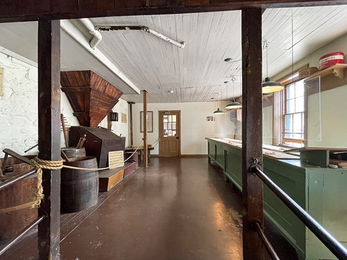 History preserved in wood and white walls. The original equipment stands ready, as if the bakers just stepped away for lunch.