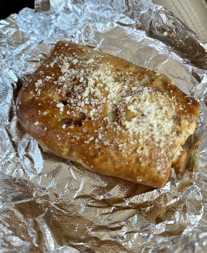 This pretzel wrap isn't just lunch—it's edible architecture, where savory fillings find themselves embraced by that distinctive pretzel chew.