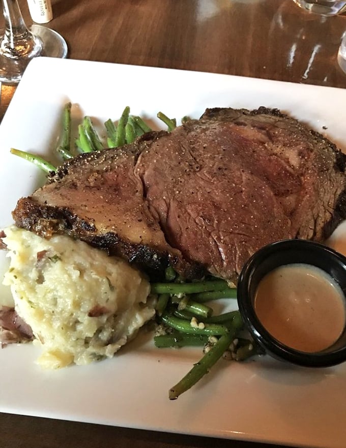 The prime rib that launched a thousand road trips. Perfectly pink, accompanied by potatoes that clearly went to finishing school.