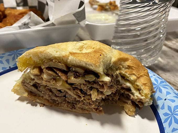 A sandwich that requires both hands and possibly a nap afterward. The prime rib isn't just tender—it practically surrenders at the sight of your fork.