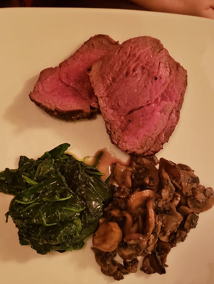 Prime rib so perfectly pink it should come with its own Instagram filter. The spinach is just there to make you feel virtuous.