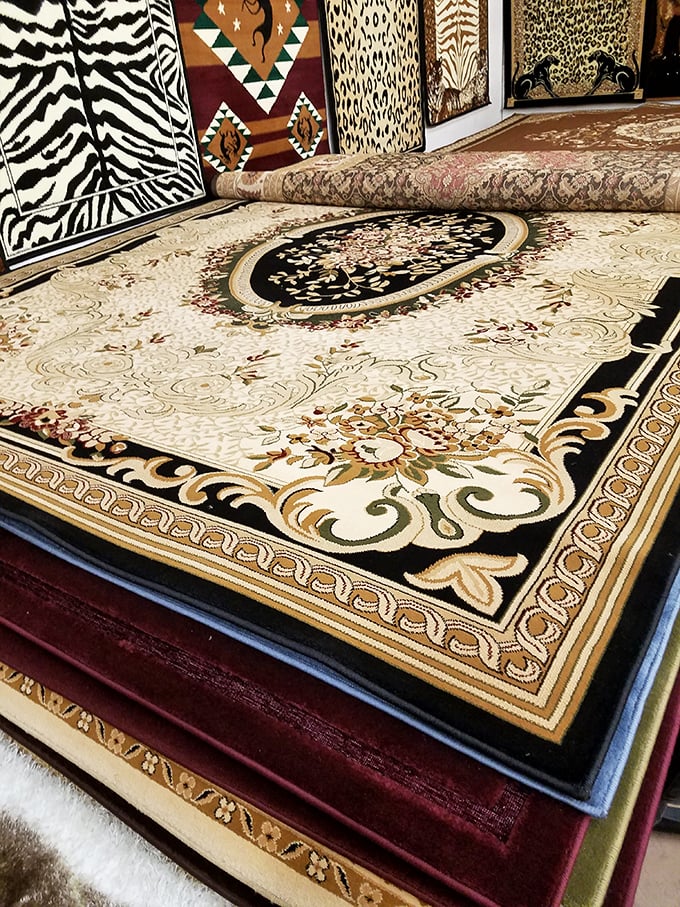 Intricate rugs stacked like pages in a storybook, each one telling tales of distant places and artistic traditions.