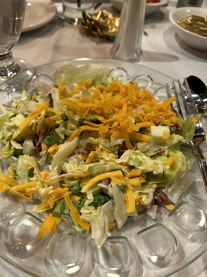 A proper supper club salad: crisp, colorful, and unapologetically topped with cheddar. Before kale was cool, this was how America got its vegetables.
