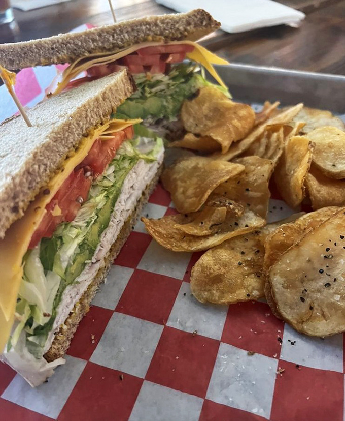 A classic turkey sandwich that proves simplicity, when done right, is anything but boring. Those house-made chips aren't just sides – they're supporting actors deserving their own award.
