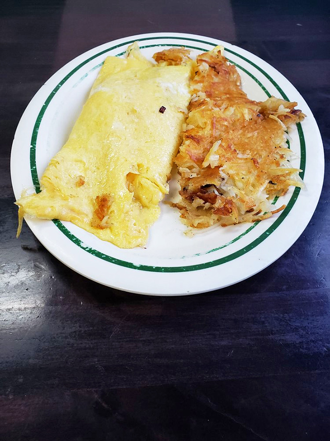 This omelet and hash browns combo isn't trying to reinvent breakfast – it's just executing it flawlessly, as it has for generations.