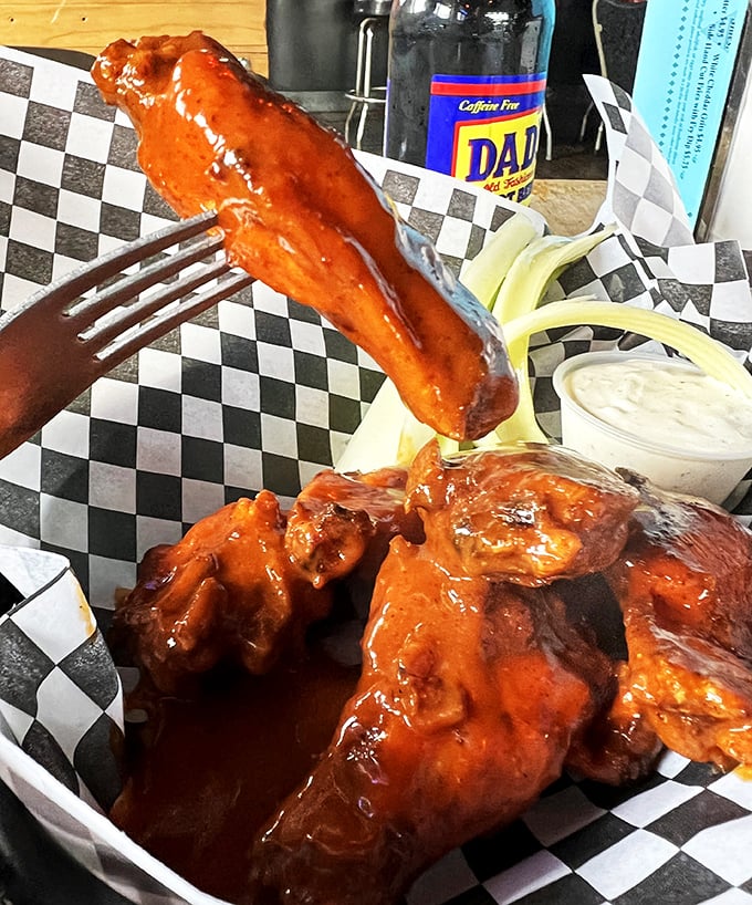 Wings that don't just get sauced—they get baptized. Glistening with tangy heat and served with cooling ranch, they're a study in delicious contrasts.