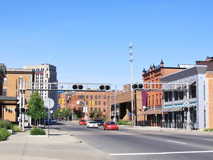 Sunset paints Kalamazoo's skyline in golden hues – affordable living that looks like a million bucks at dusk!