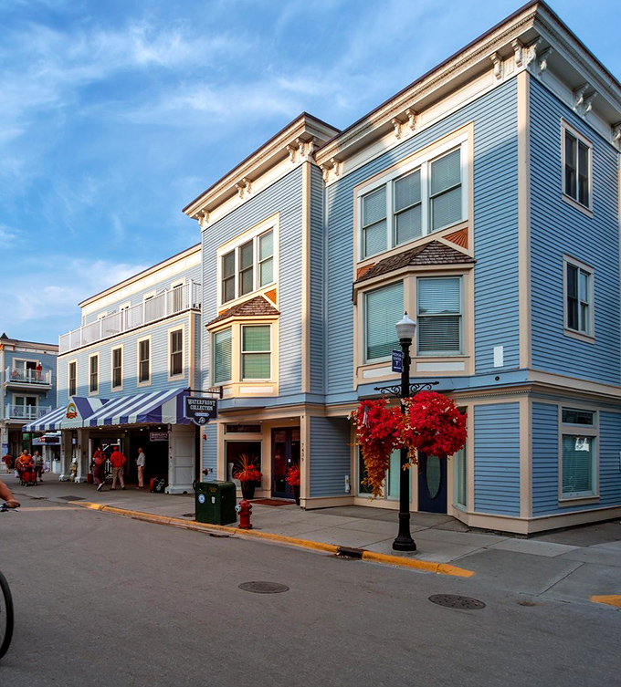 Mackinac Island's blue-hued buildings stand like a Victorian dream against Michigan's summer skies—no cars, no rush, no worries.