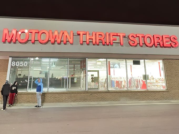 Motown Thrift's glowing red sign lights up the night like a beacon for late-night treasure hunters.