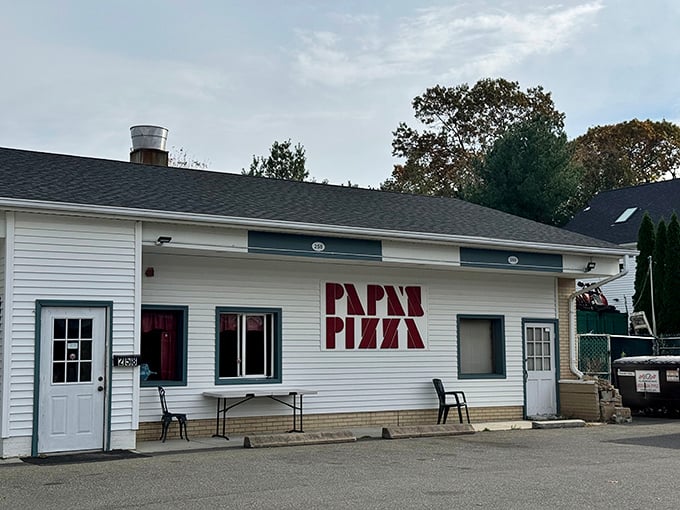 Papa's Pizza: That stark white building with bold red lettering is like a pizza haiku—simple, direct, and perfectly to the point.