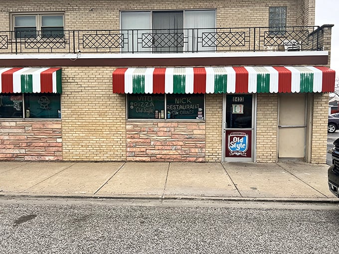 Vito & Nick's vintage storefront with classic Italian striped awning is like a time portal to Chicago's pizza past.
