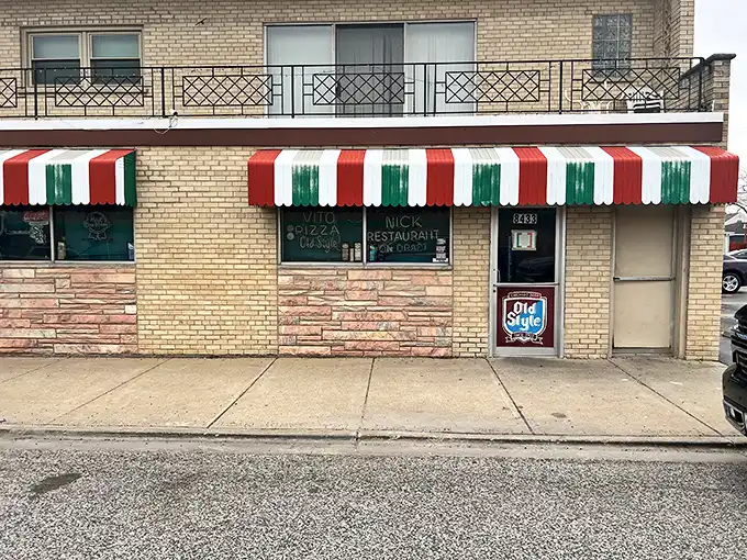 Vito & Nick's vintage storefront with classic Italian striped awning is like a time portal to Chicago's pizza past.