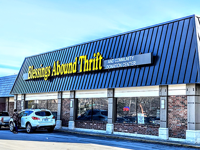 The blue-roofed thrift haven stands ready for exploration—like a secondhand Disneyland for the budget-conscious.