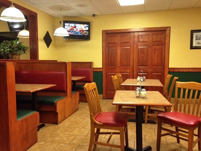 Inside Gino's, those cozy booths have witnessed countless family dinners and first dates – all centered around perfect pizza.