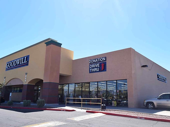 The desert sun illuminates this Goodwill's entrance, promising air-conditioned treasure hunting inside – Arizona's favorite indoor sport.