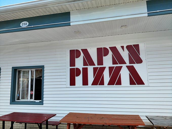 Papa's Pizza: No frills, no fuss, just that iconic red lettering promising pizza perfection that generations of Milford locals swear by.