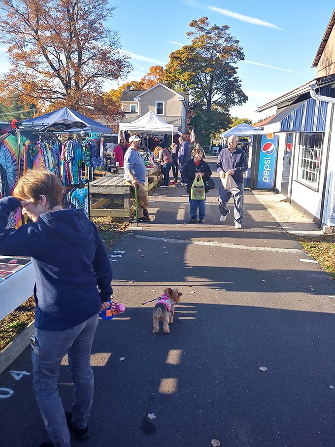 Brick pathways guide shoppers through Rice's outdoor market, where every turn reveals new possibilities under bright blue skies.