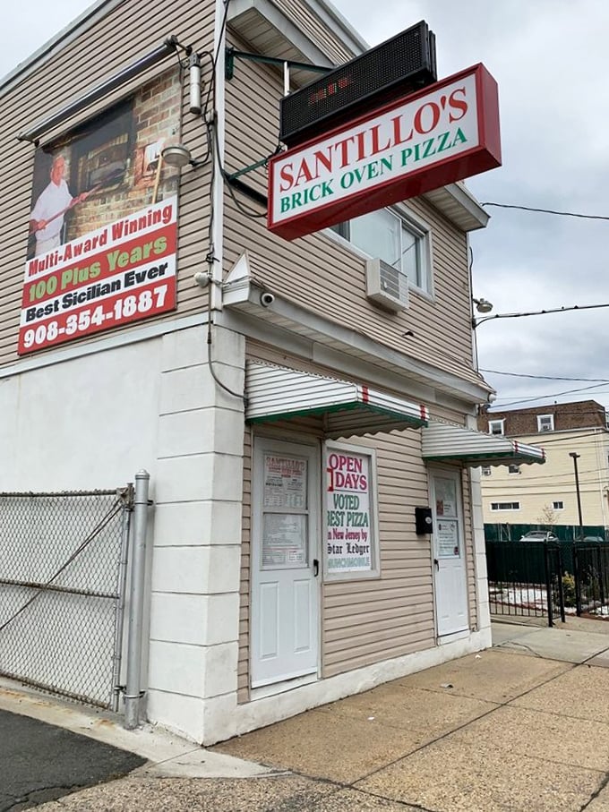 That humble doorway is actually a portal to pizza paradise – where Santillo's brick oven works its century-old magic.