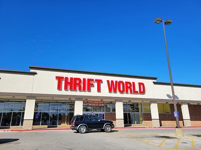 Morning sunshine makes Thrift World's bold red letters pop against the sky. A lone vehicle suggests you might beat the crowds!