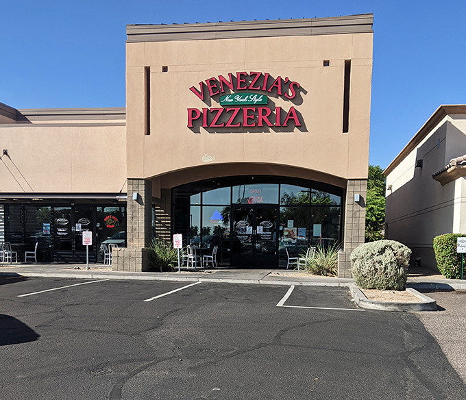 Don't let the simple exterior fool you—inside this unassuming building lurks pizza that would make a Manhattan cabbie feel right at home.