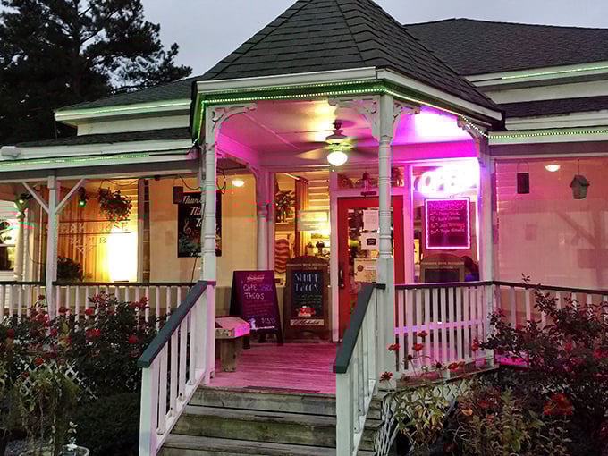 By night, Village Steakhouse glows with the kind of warm, inviting light that says, "Yes, we have dessert, but you'll remember the steak forever."