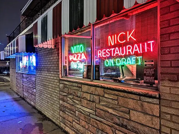 Those neon signs in the window aren't just decoration—they're beacons guiding pizza pilgrims to thin-crust nirvana.