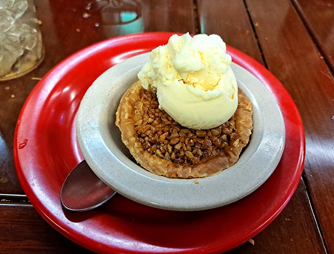 Not just dessert, but a spiritual experience—this pecan pie topped with vanilla ice cream is what clouds taste like in Southern heaven.