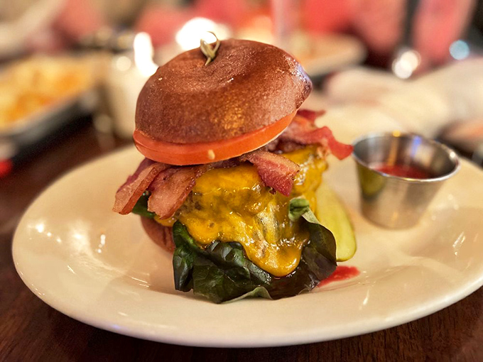 This isn't just a burger—it's architecture. The bacon positioning alone deserves an award from the Burger Engineering Society.
